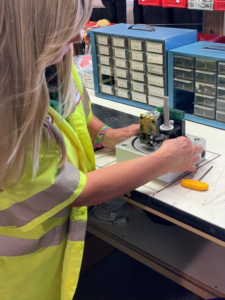 Quality Control Personnel testing actuators prior to shipment.